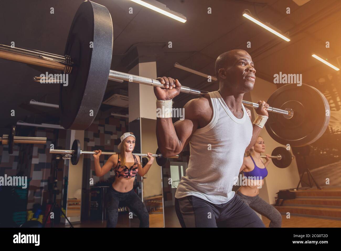 Barbell weight lifting group weightlifting workout exercise gym Stock ...