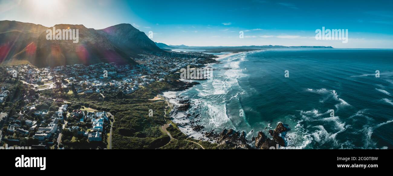 Panoramic aerial shot of historical seaside village next to mountains ...