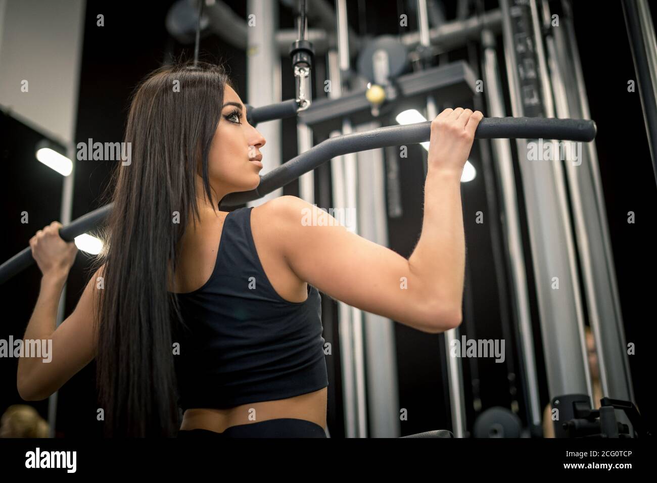 sport, fitness, teamwork and people concept - young woman flexing ...