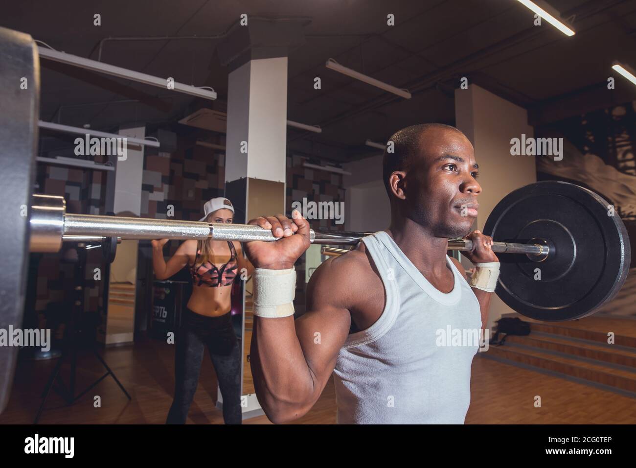 Barbell weight lifting group weightlifting workout exercise gym Stock ...