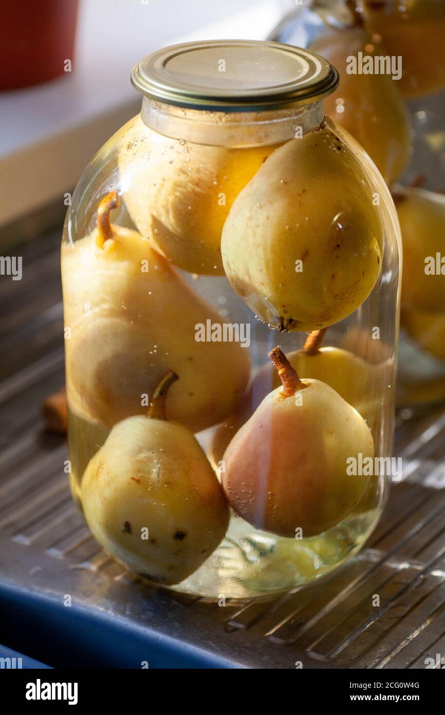 pear compote. Canned pears in a glass jar. Homemade fruit supplies for ...