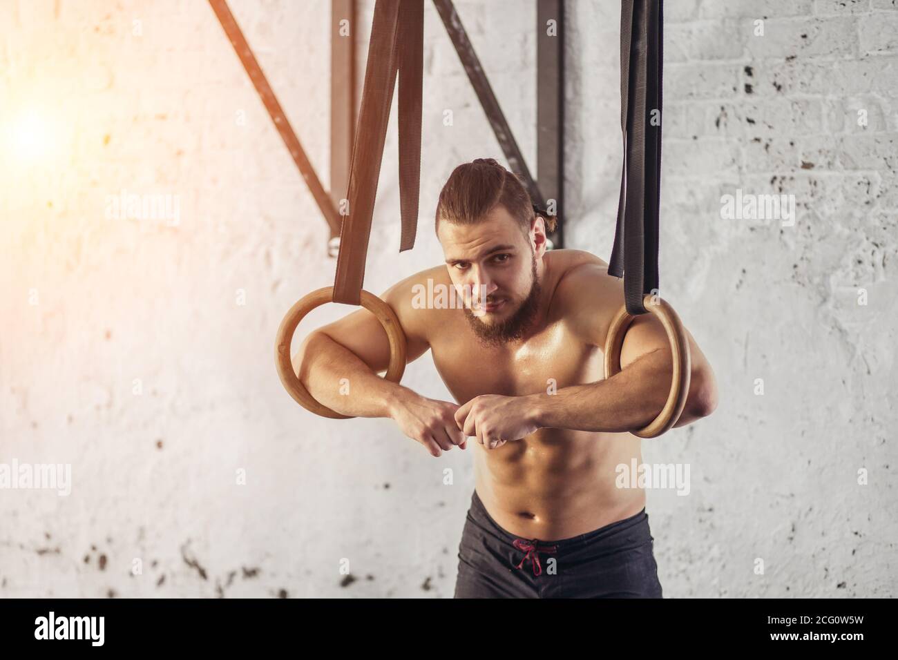 Young pretty man tired after weightlifting at gym Stock Photo - Alamy