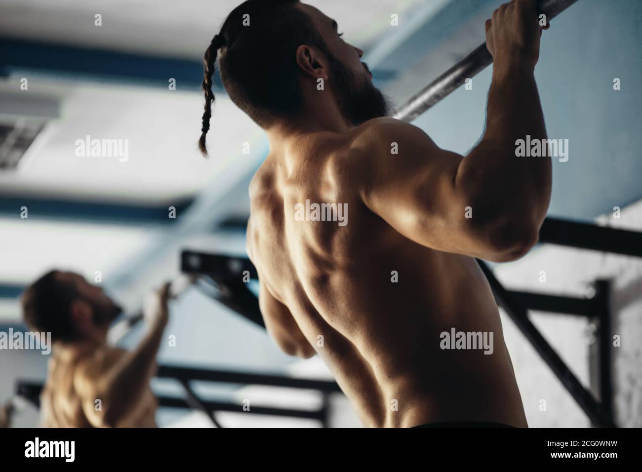 Fitness toes to bar men and woman pull-ups tree bars workout exercise ...