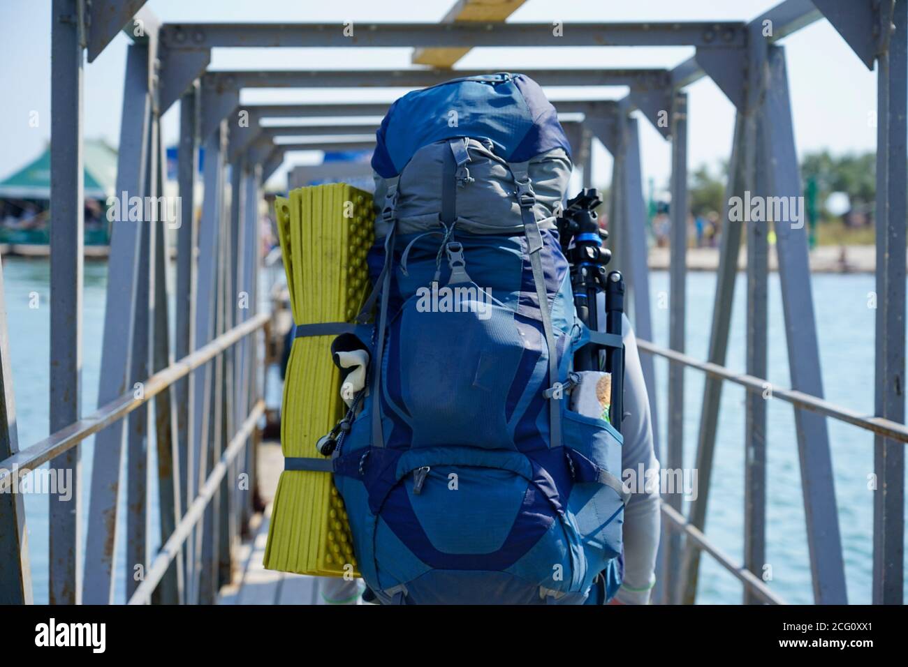 The guy is carrying a big backpack Stock Photo - Alamy