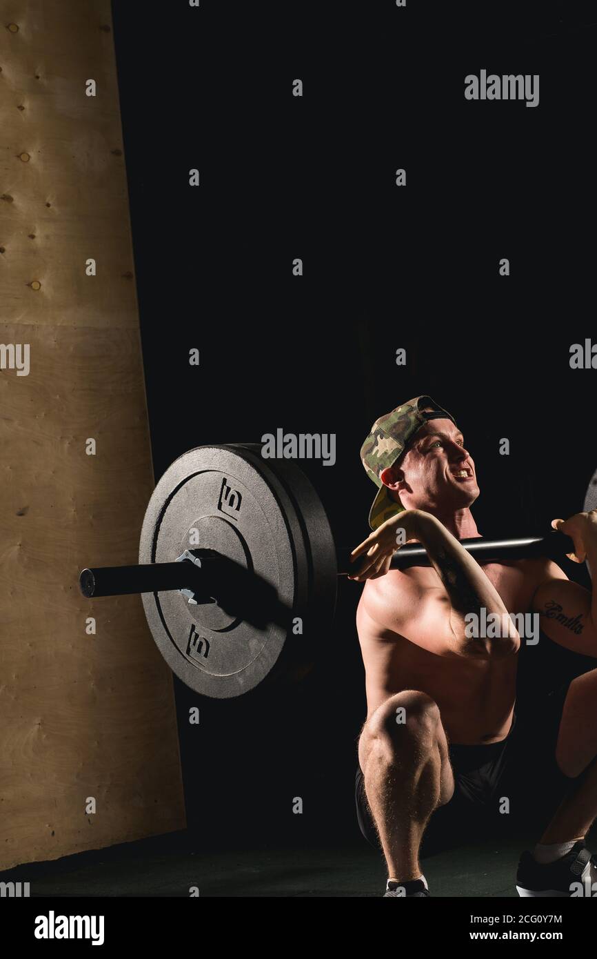 Cross fit fitness gym heavy weight lifting bar by strong man workout ...