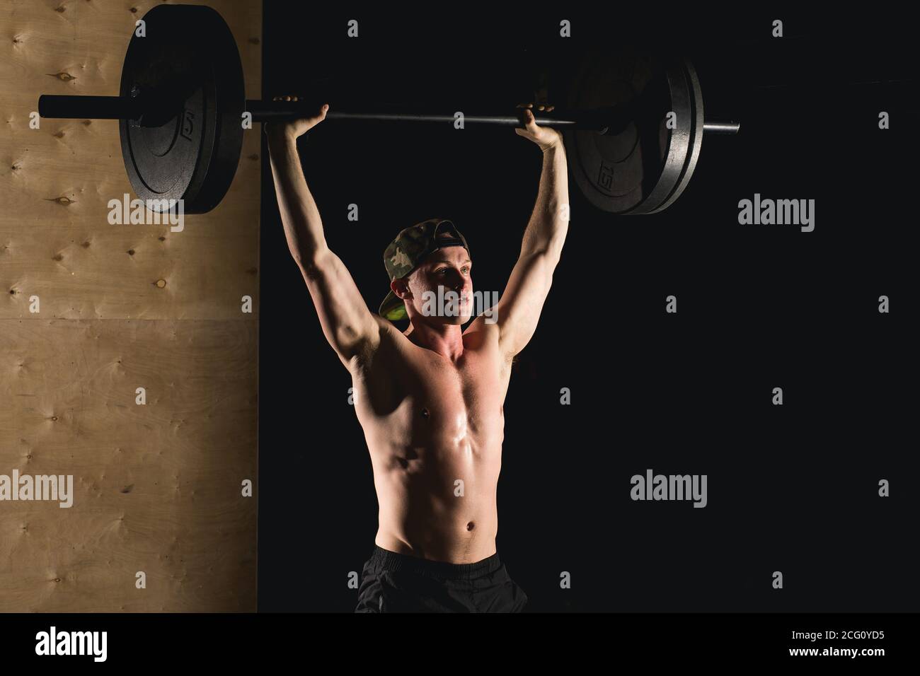 Cross fit fitness gym heavy weight lifting bar by strong man workout ...