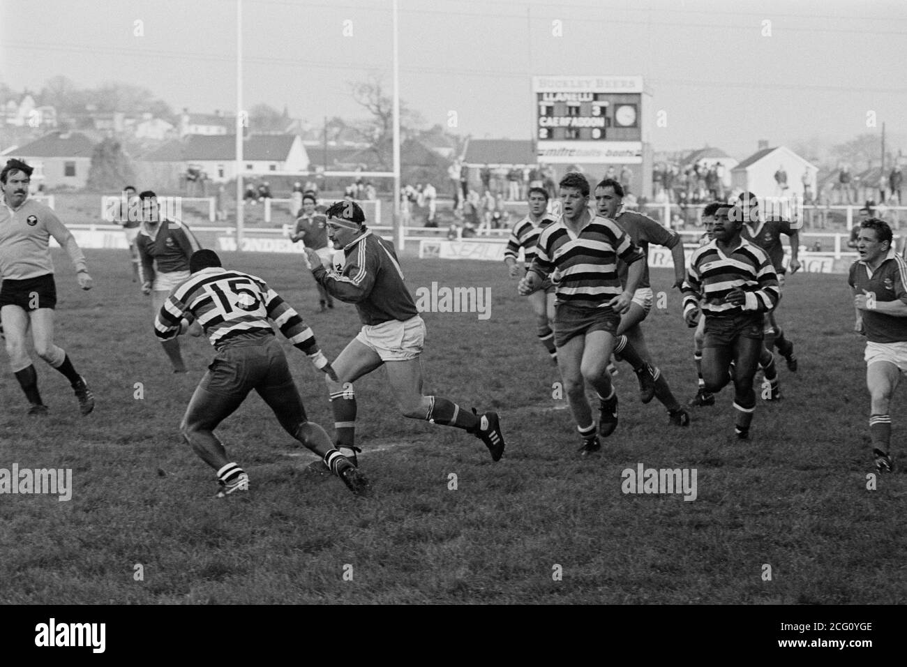 Llanelli RFC and Wales prop Anthony Buchanan bursting through the Bath ...