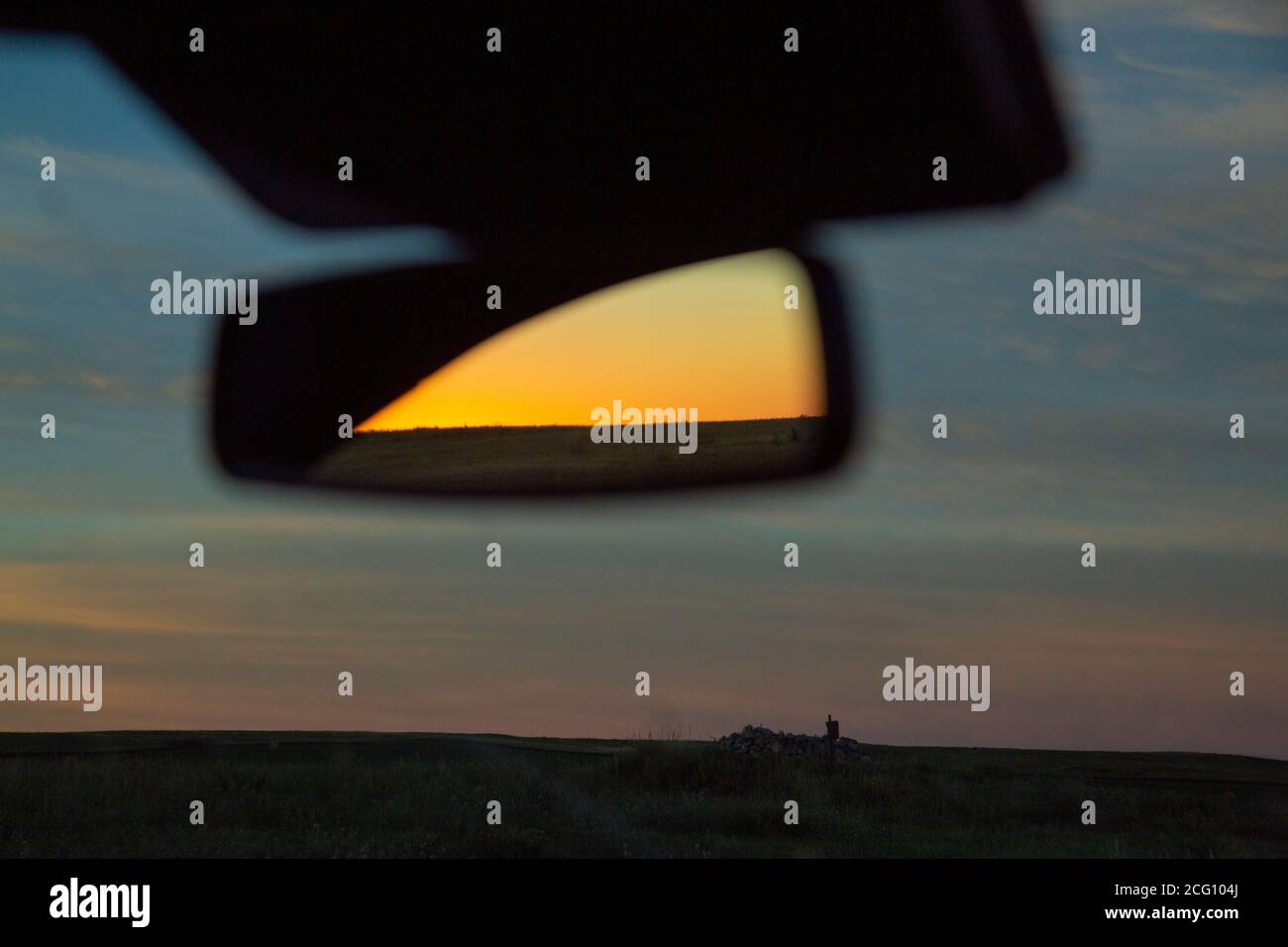 Sunrise view in car rearview mirror Stock Photo - Alamy