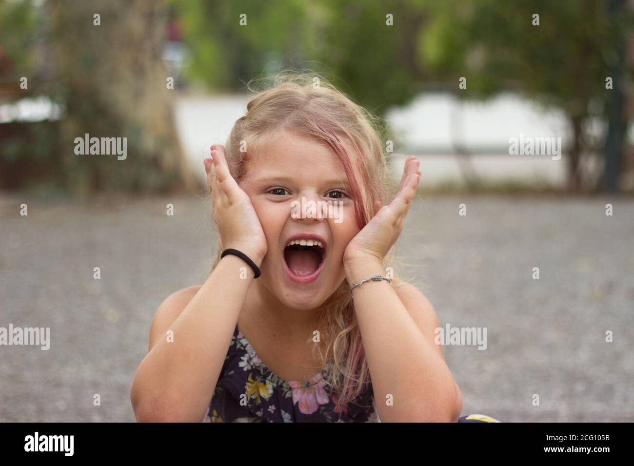 Funny little girl making faces hi-res stock photography and images - Alamy