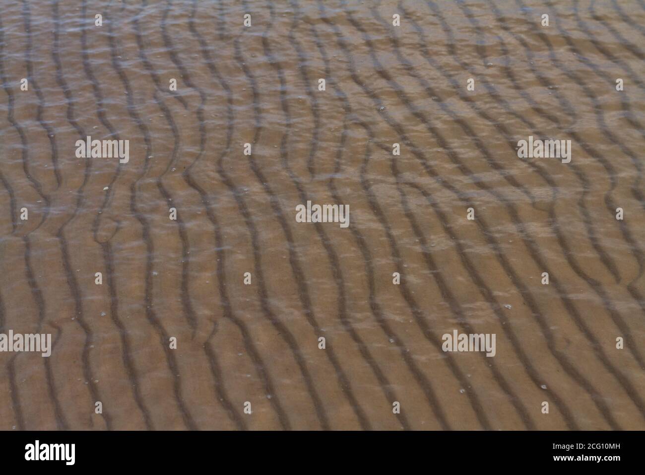 Sand texture lines under sea water Stock Photo - Alamy