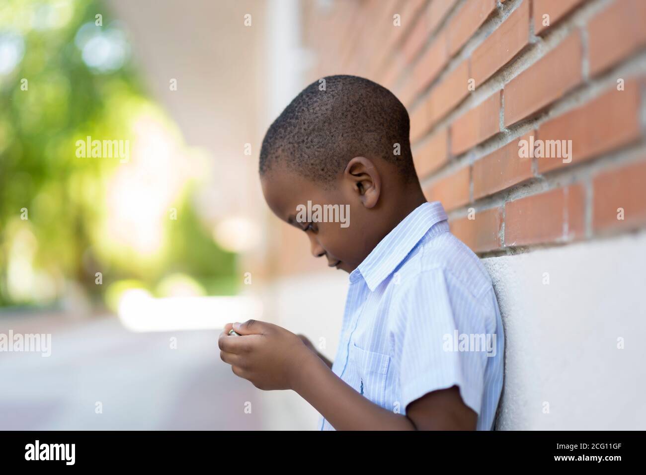 African boy using his smartphone Stock Photo - Alamy