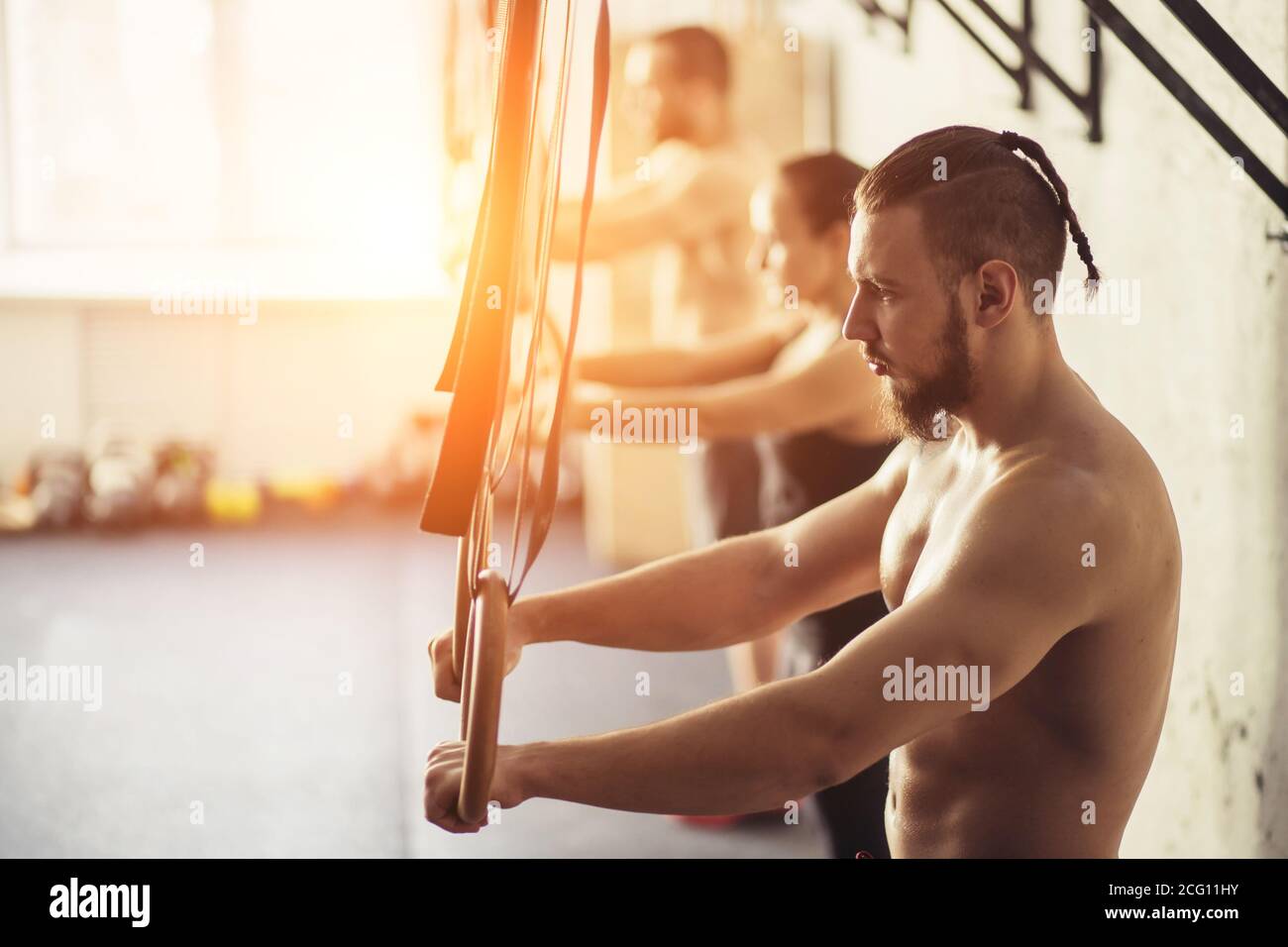 Fitness dip ring man relaxed after workout at gym dipping exercise ...