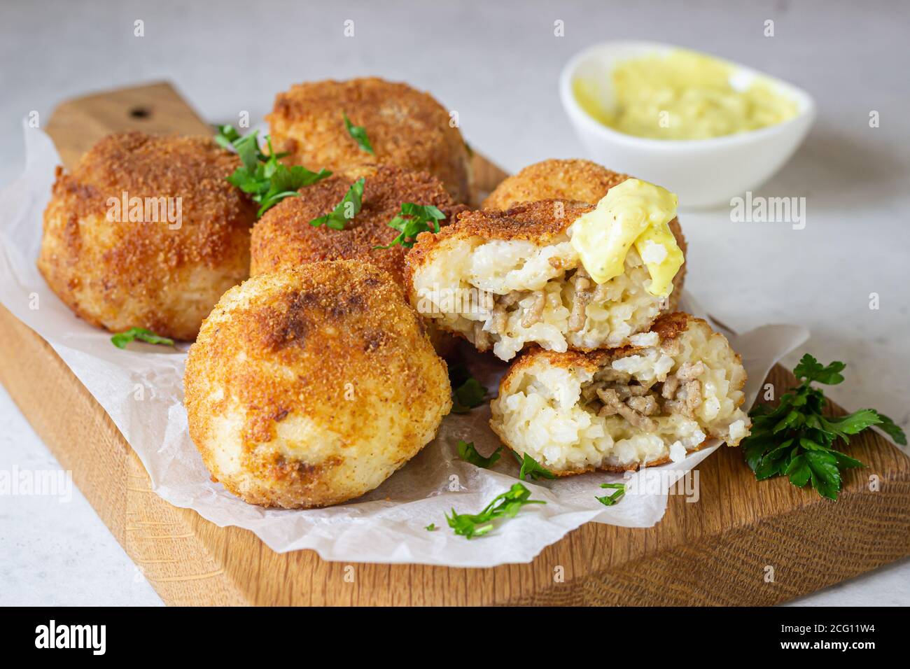 Classic homemade Italian arancini. Fried rice balls with minced meat ...