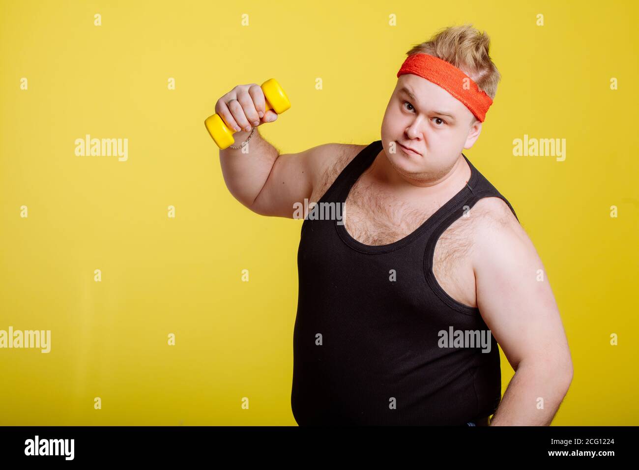 Fat young man boxing and looking camera Stock Photo - Alamy