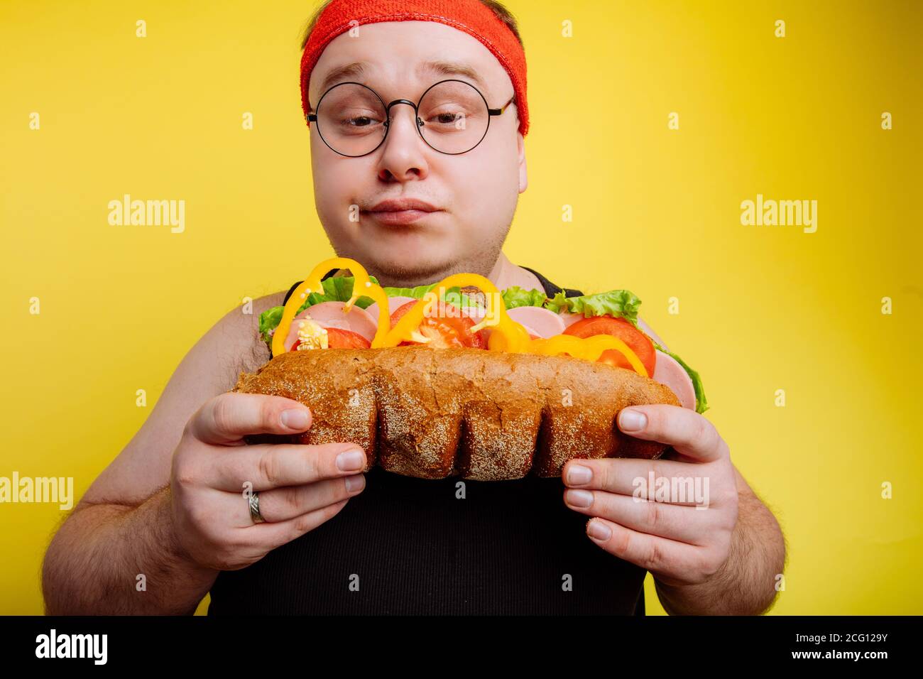 Diet failure of fat man eating fastfood . Happy smile overweight male ...