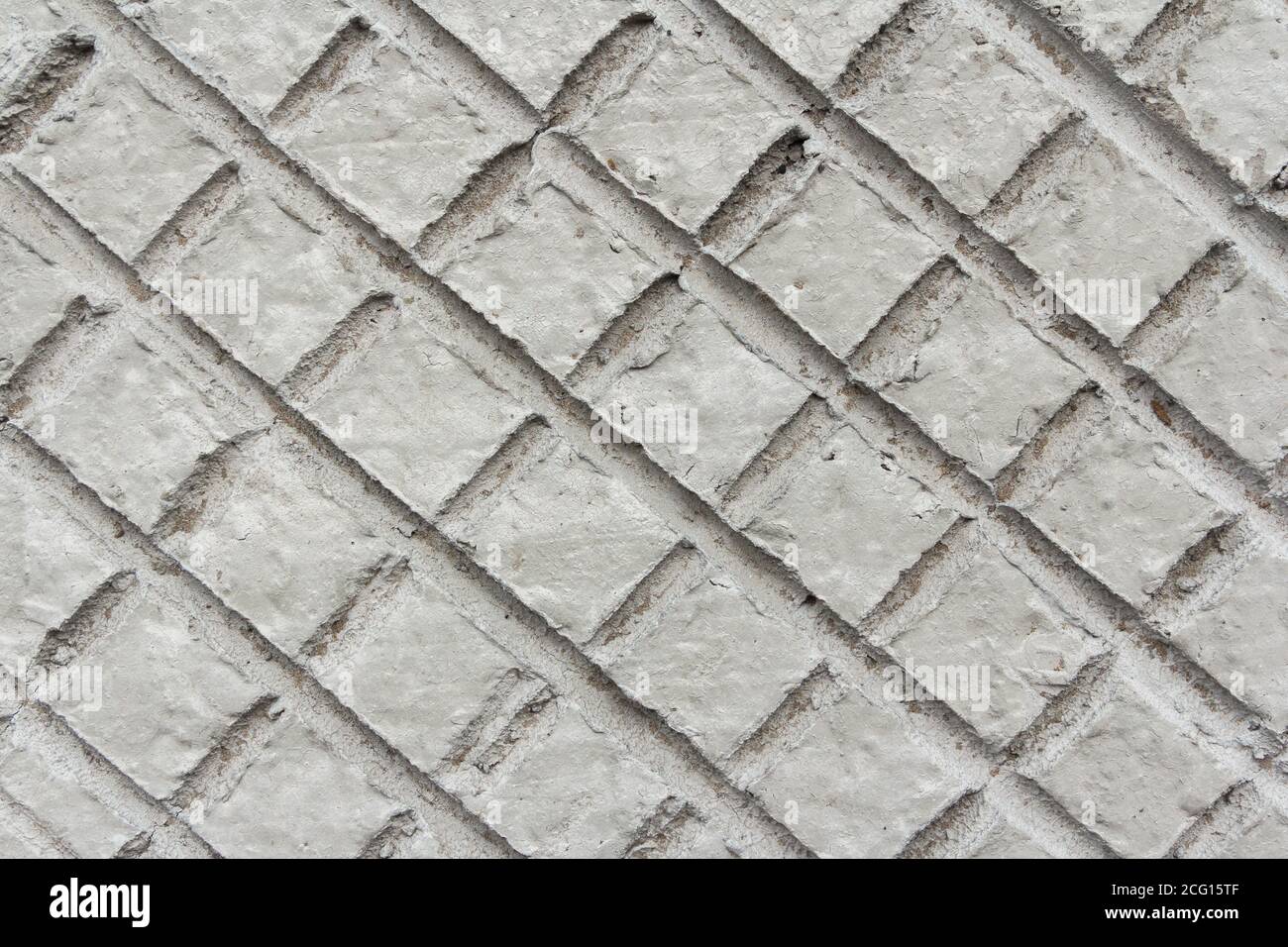 Concrete texture with squeezed shapes in the form of a diamond ...