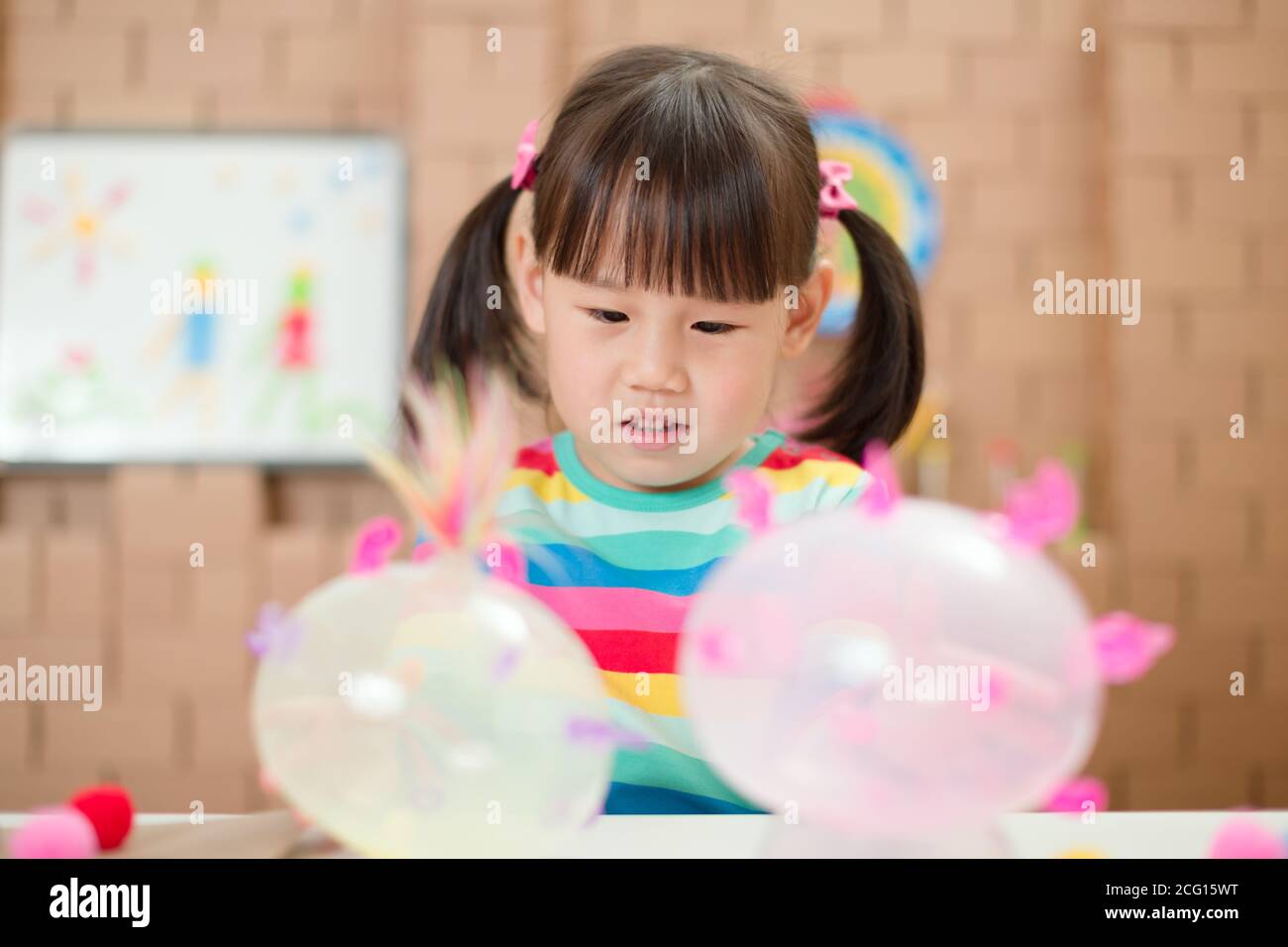 young girl making craft for homeschooling Stock Photo - Alamy