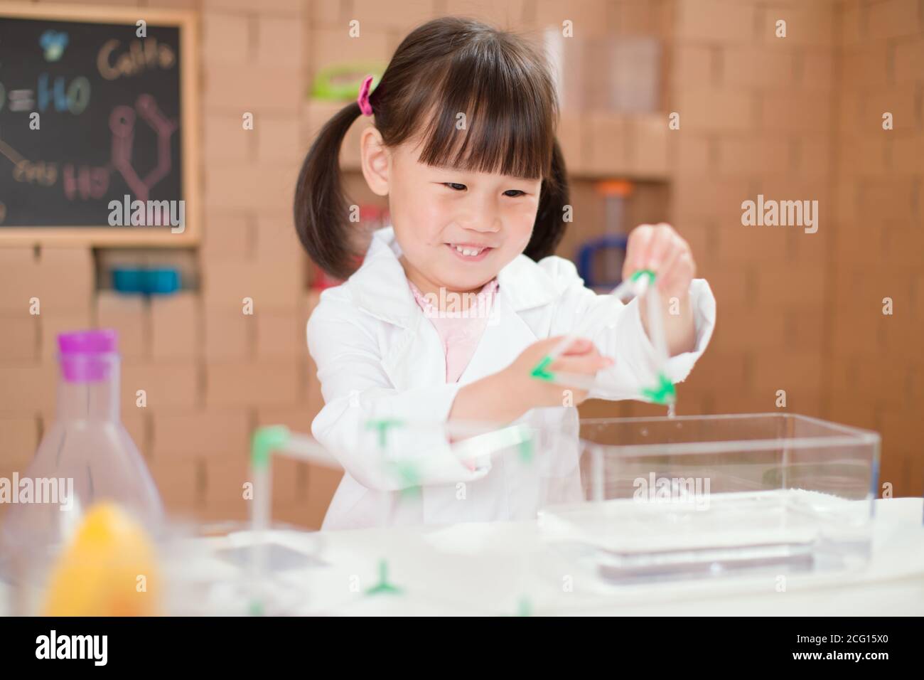 young girl play science experiments for homeschooling Stock Photo - Alamy