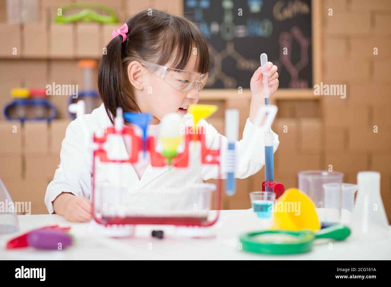 young girl play science experiments for homeschooling Stock Photo - Alamy