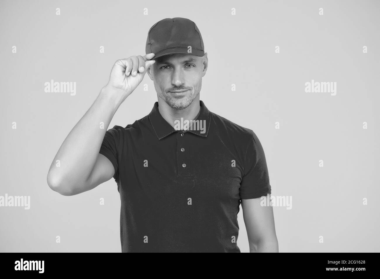 Keep it casual. Serious man wear red cap yellow background. Handsome ...