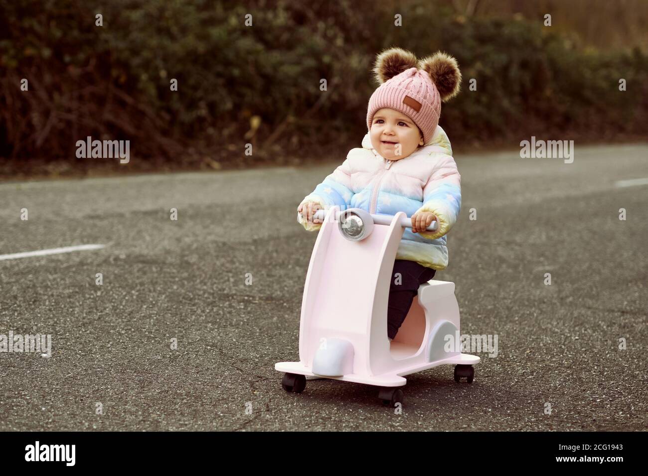 A baby driving a motorcycle Stock Photo - Alamy