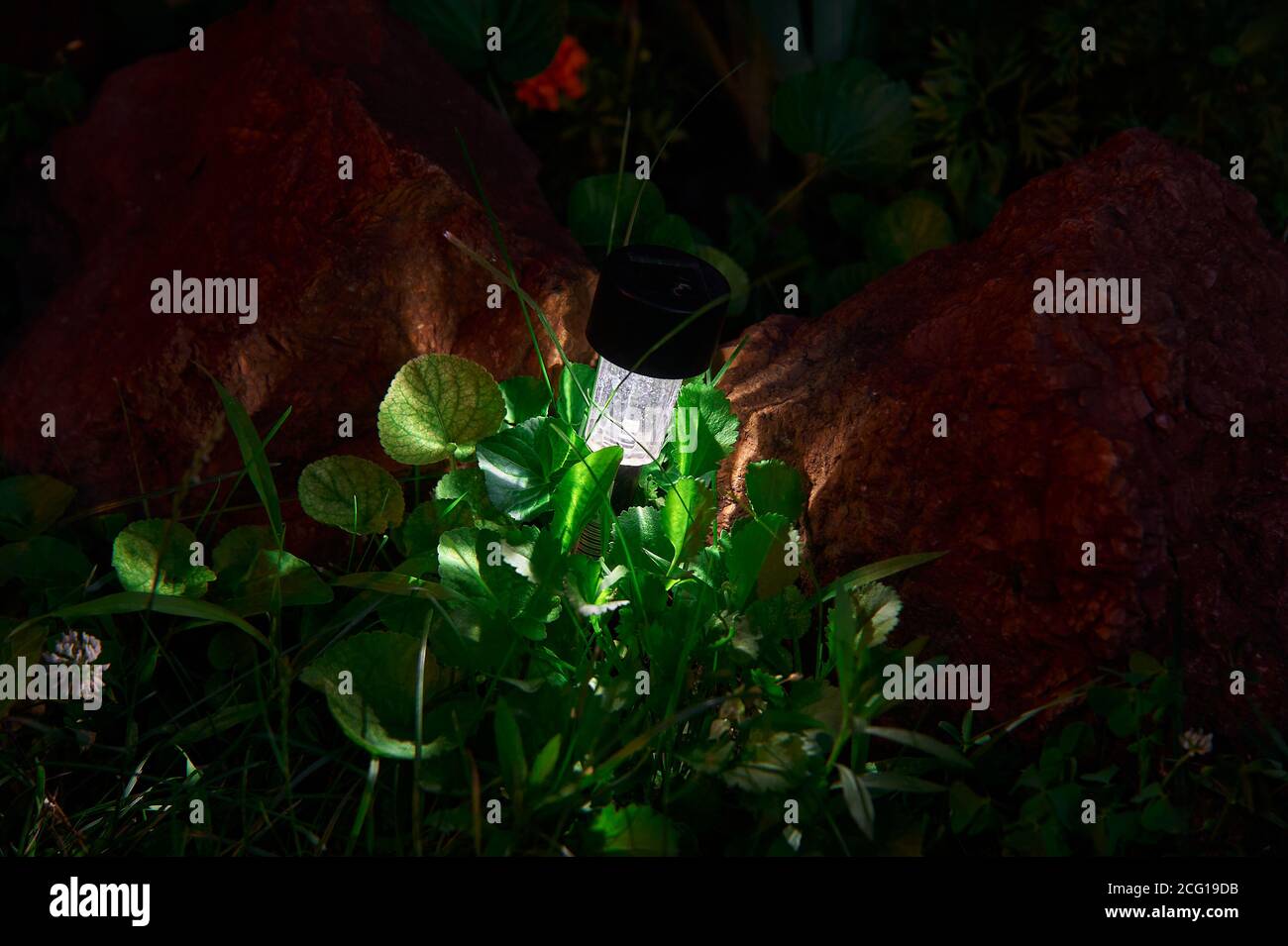 solar powered garden flashlight glows at night, flashlight glows in the ...