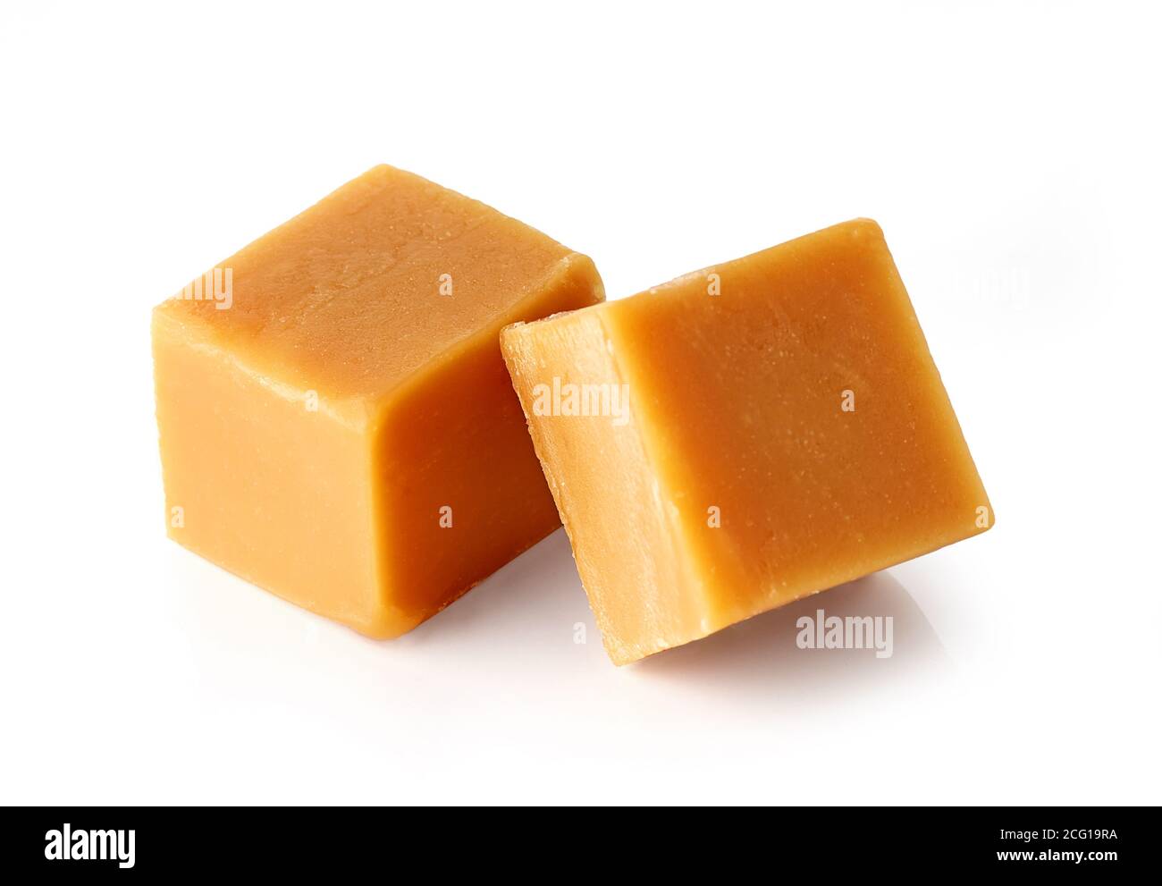 two caramel candies isolated on white background Stock Photo - Alamy