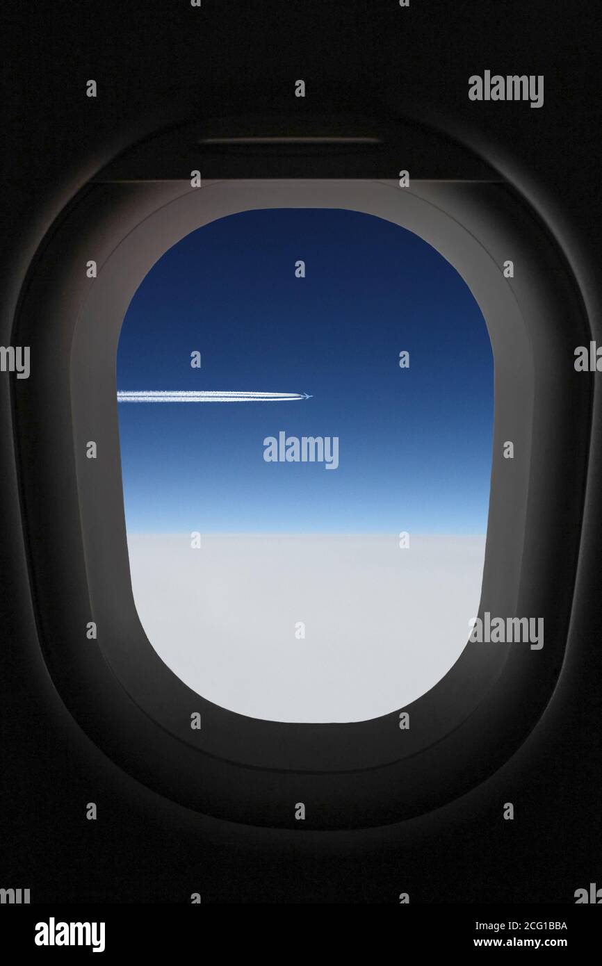 View through airplane window, porthole of an airplane that flys above ...