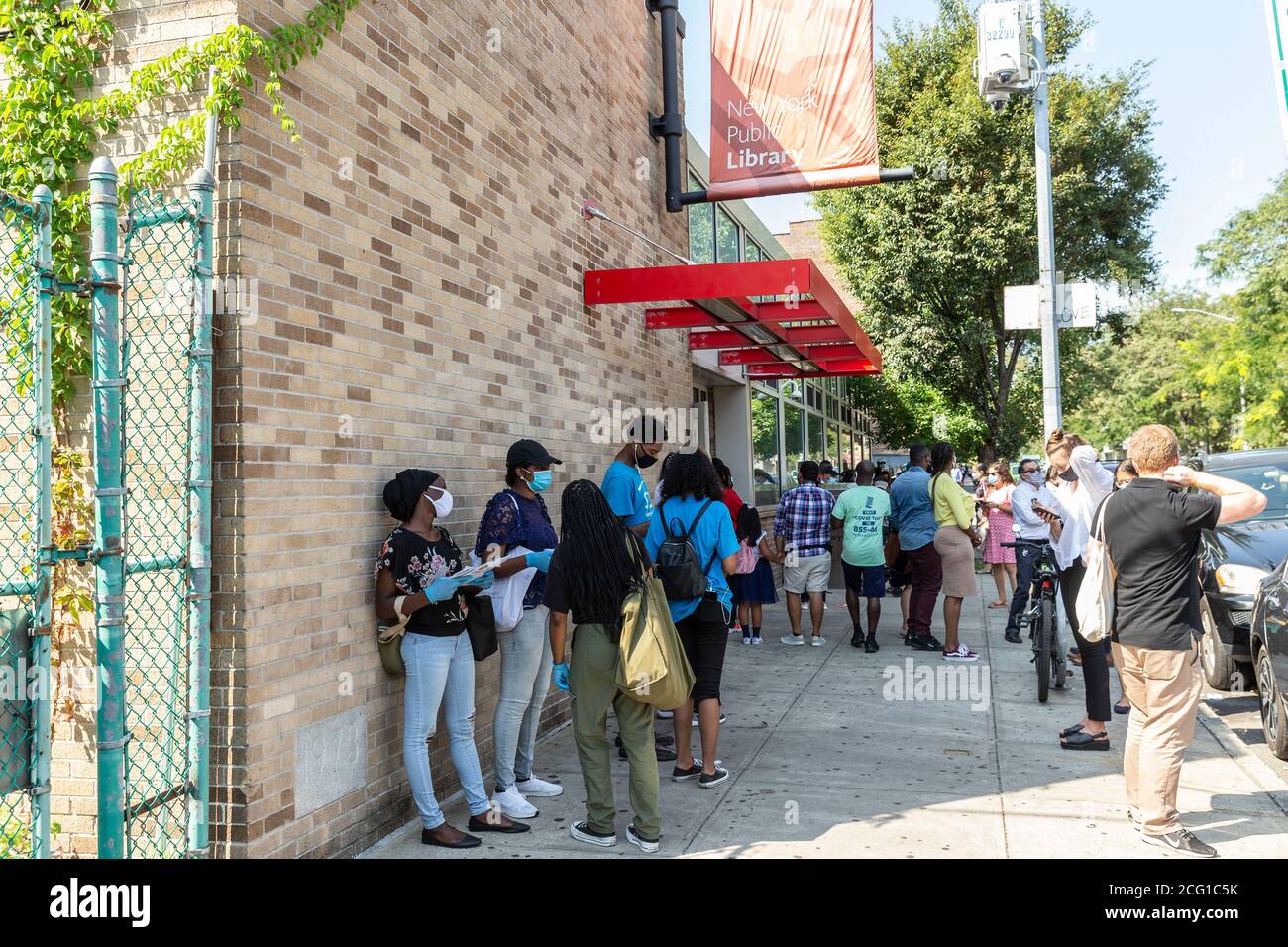 New York, NY - September 8, 2020: People waiting inline in the ...