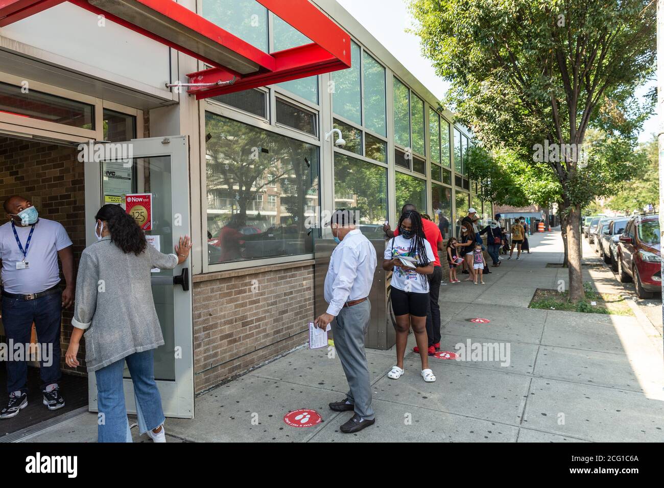New York, NY - September 8, 2020: People waiting inline in the ...