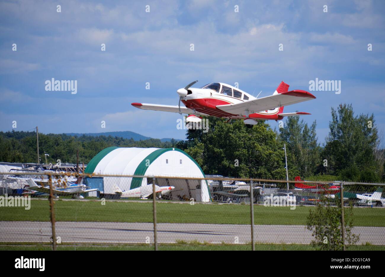 White and red Piper PA-28-180 Cherokee plane taking off from Rockcliffe ...