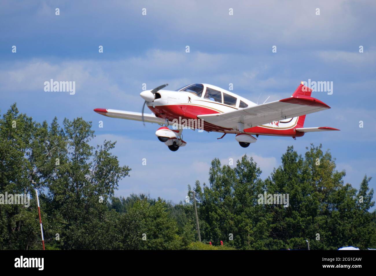 White and red Piper PA-28-180 Cherokee plane taking off from Rockcliffe ...
