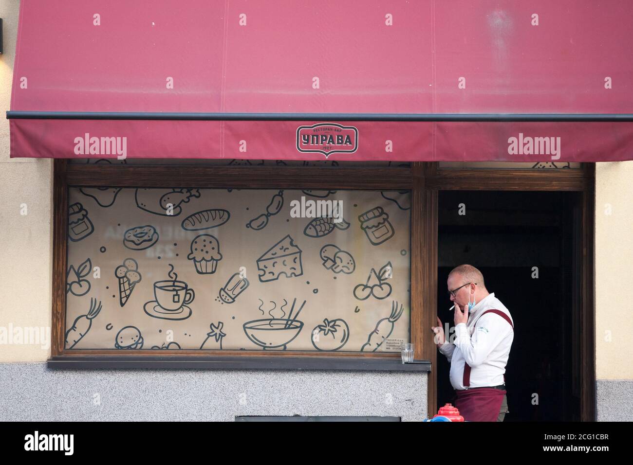 Man smoking cigarette in restaurant hi-res stock photography and images ...