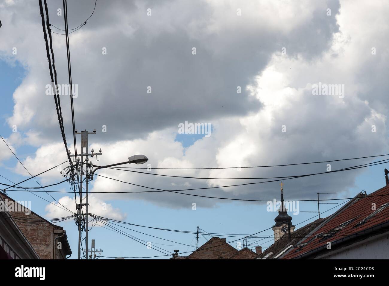 Messy cable management on a Old power electric line with a power supply ...