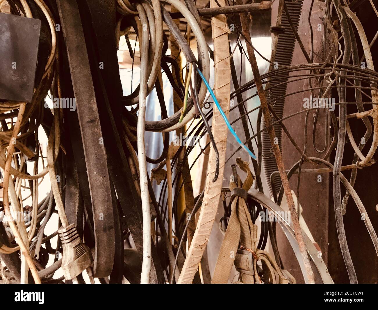 Many old different used electrical cables and wires hanging background ...