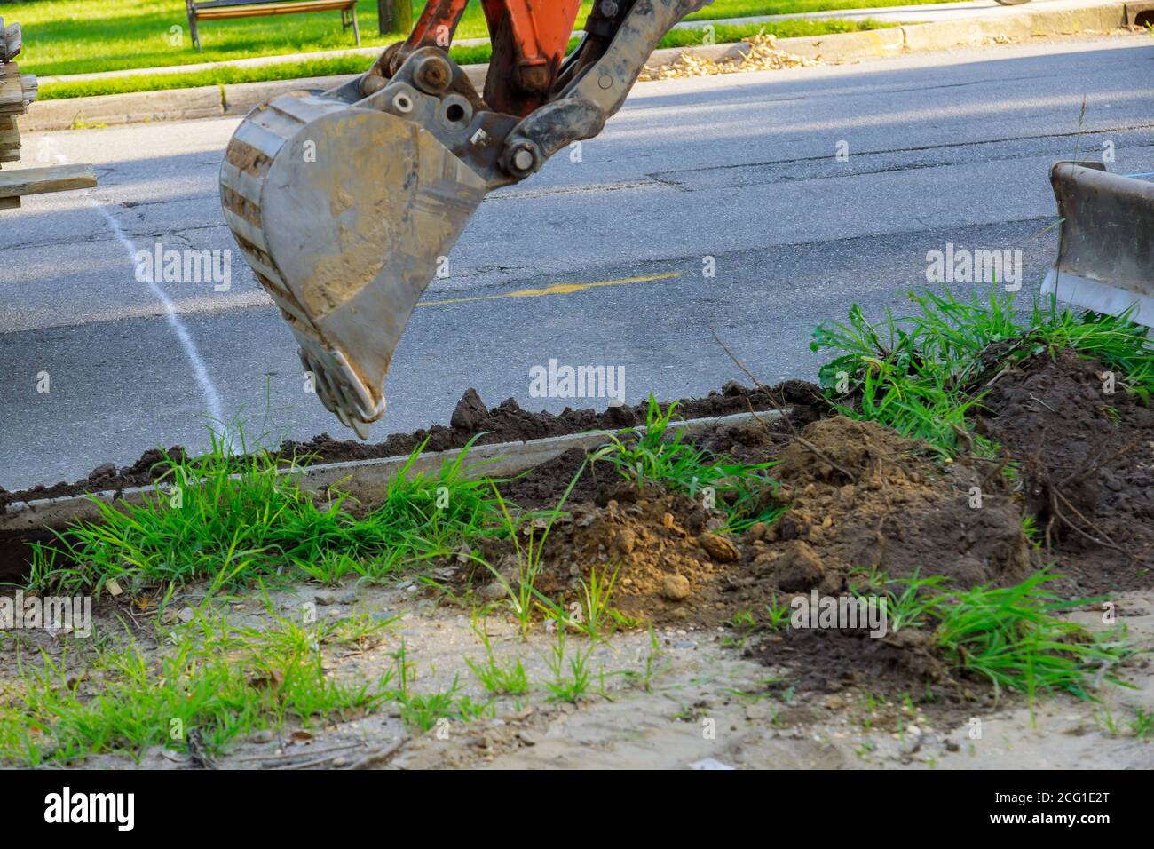 Paving out sewer line machinery for road work excavation loading ...