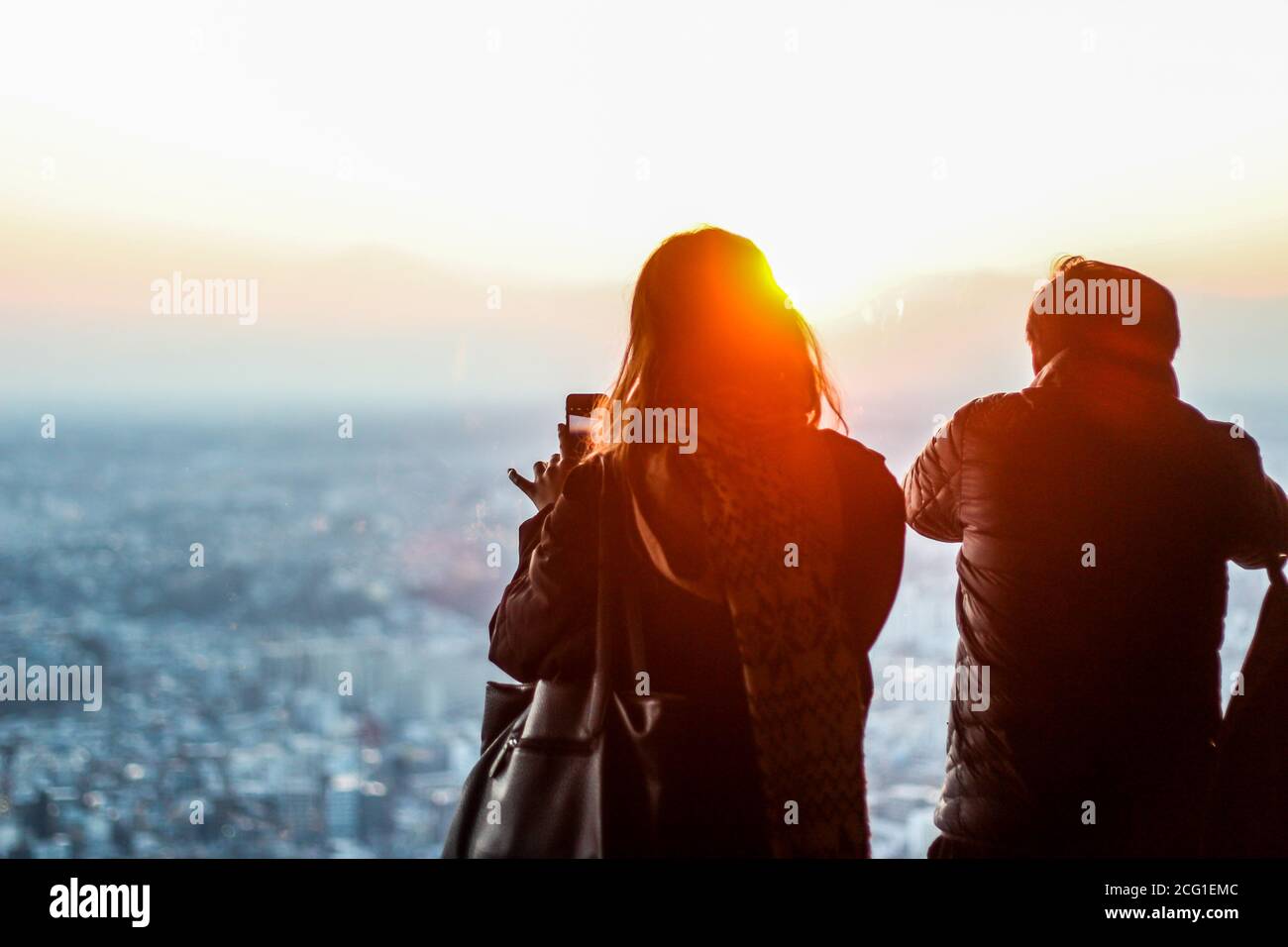 People looking out over the city at an observation deck. Yokohama ...