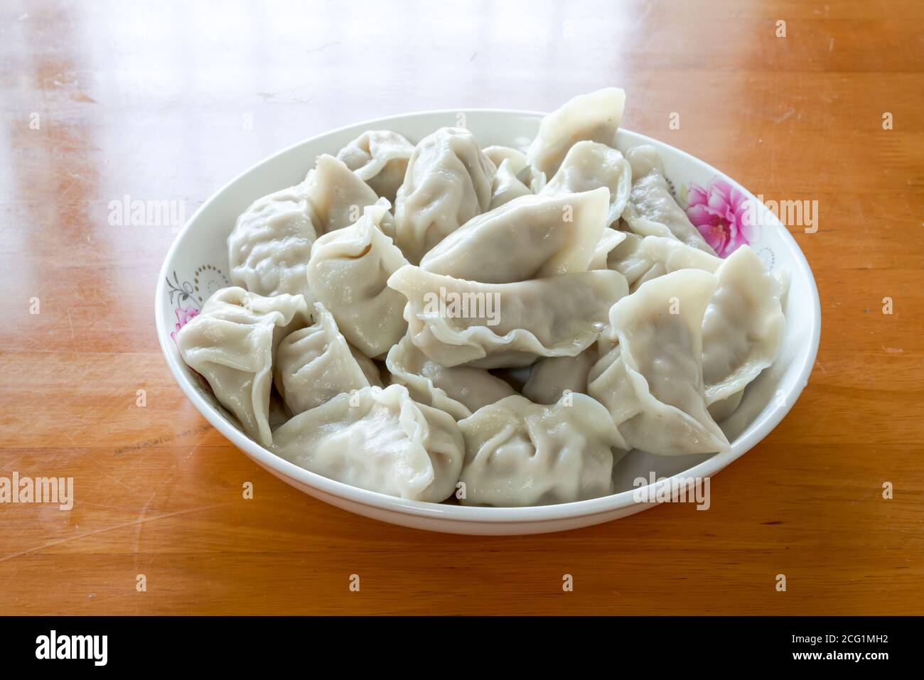 Chinese family eating dumplings hi-res stock photography and images - Alamy