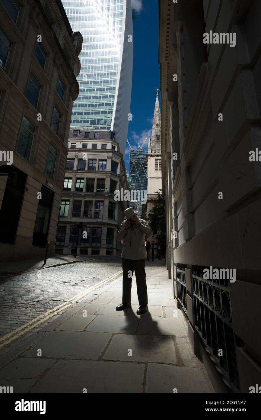 People being illuminate by the suns reflection from half-finished 37 ...