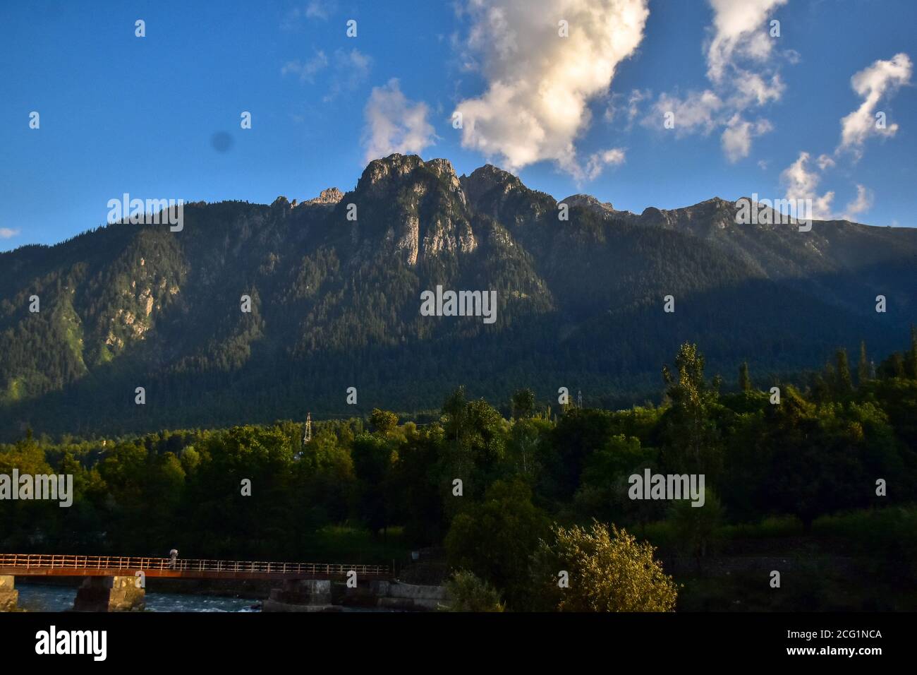 Srinagar, India. 08th Sep, 2020. A man walks through a foot-bridge in ...