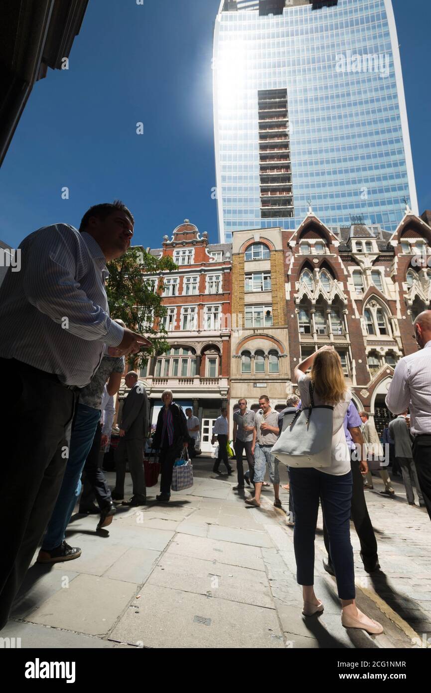 People being illuminate by the suns reflection from half-finished 37 ...