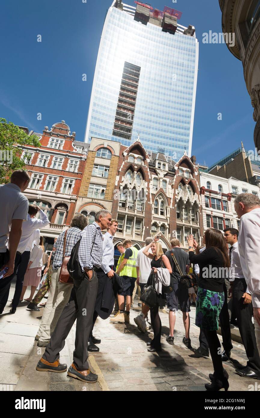 People being illuminate by the suns reflection from half-finished 37 ...