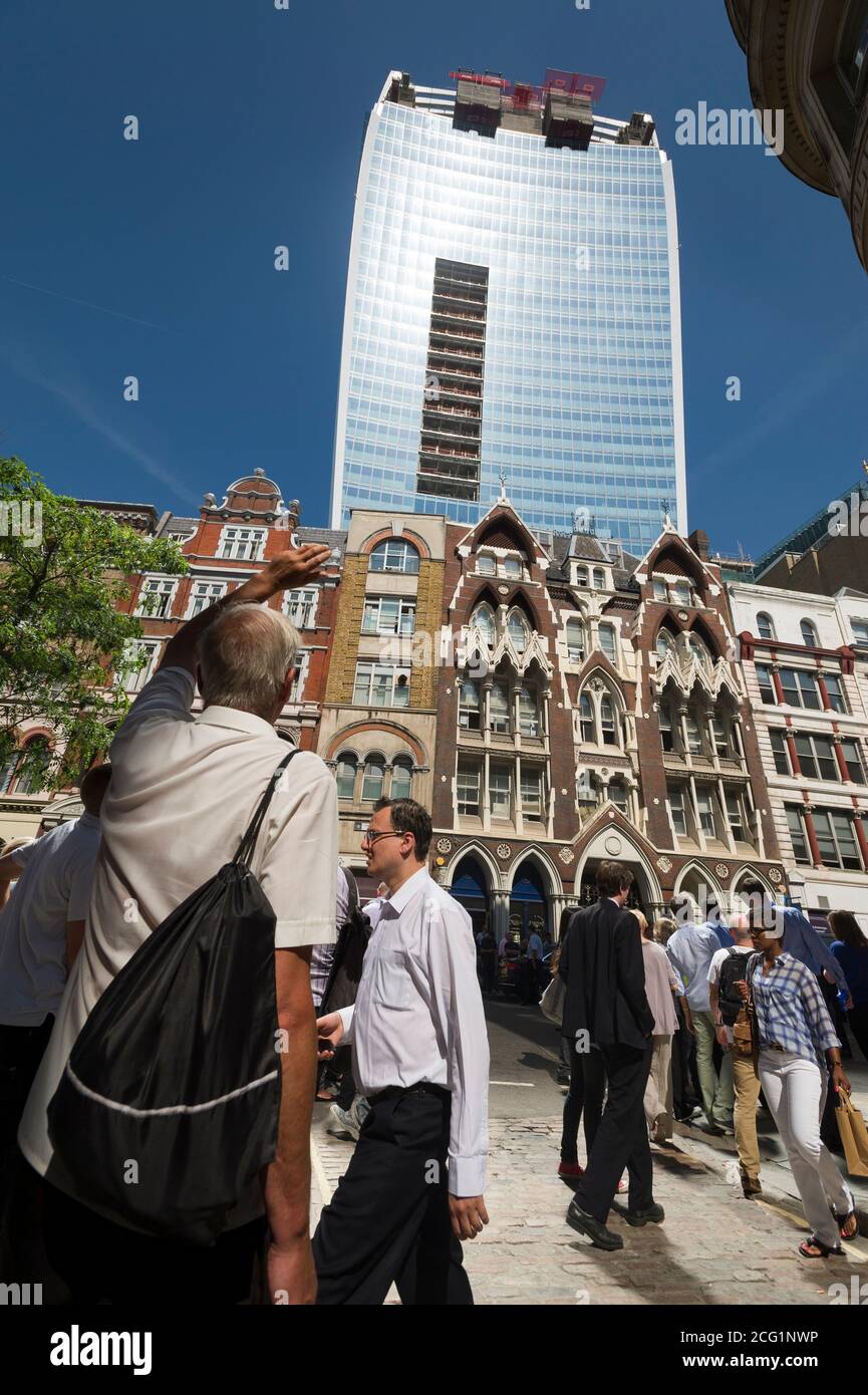 People being illuminate by the suns reflection from half-finished 37 ...