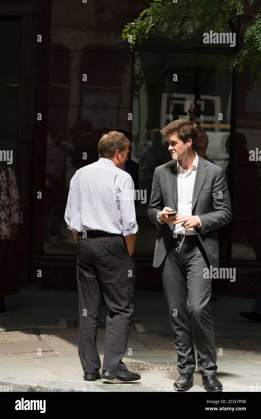 People being illuminate by the suns reflection from half-finished 37 ...