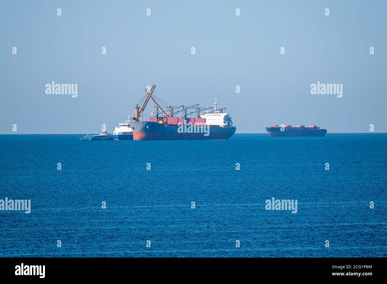Bulk carrier is being loaded at sea Stock Photo - Alamy