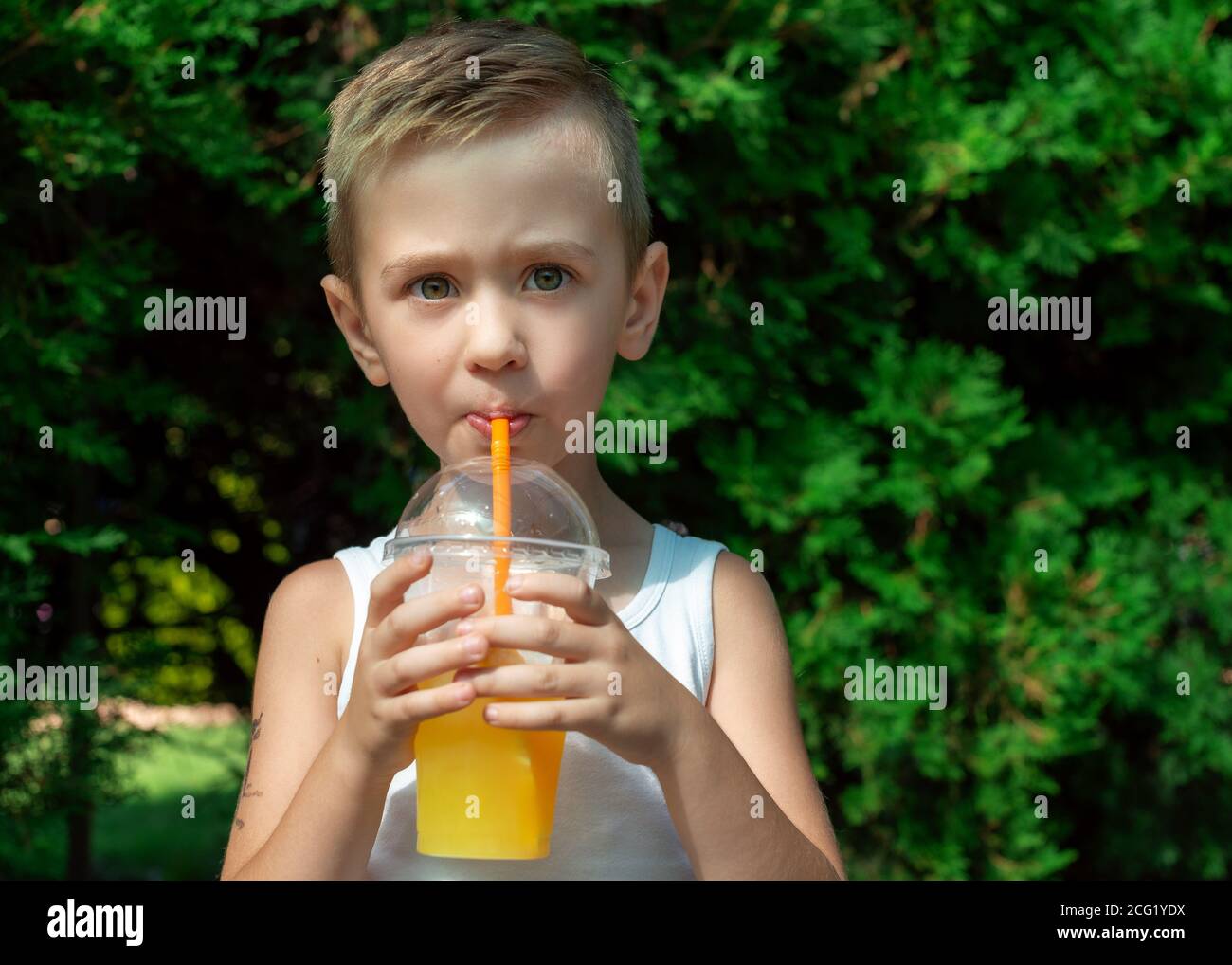 Kid drinking soft drink orange hi-res stock photography and images - Alamy