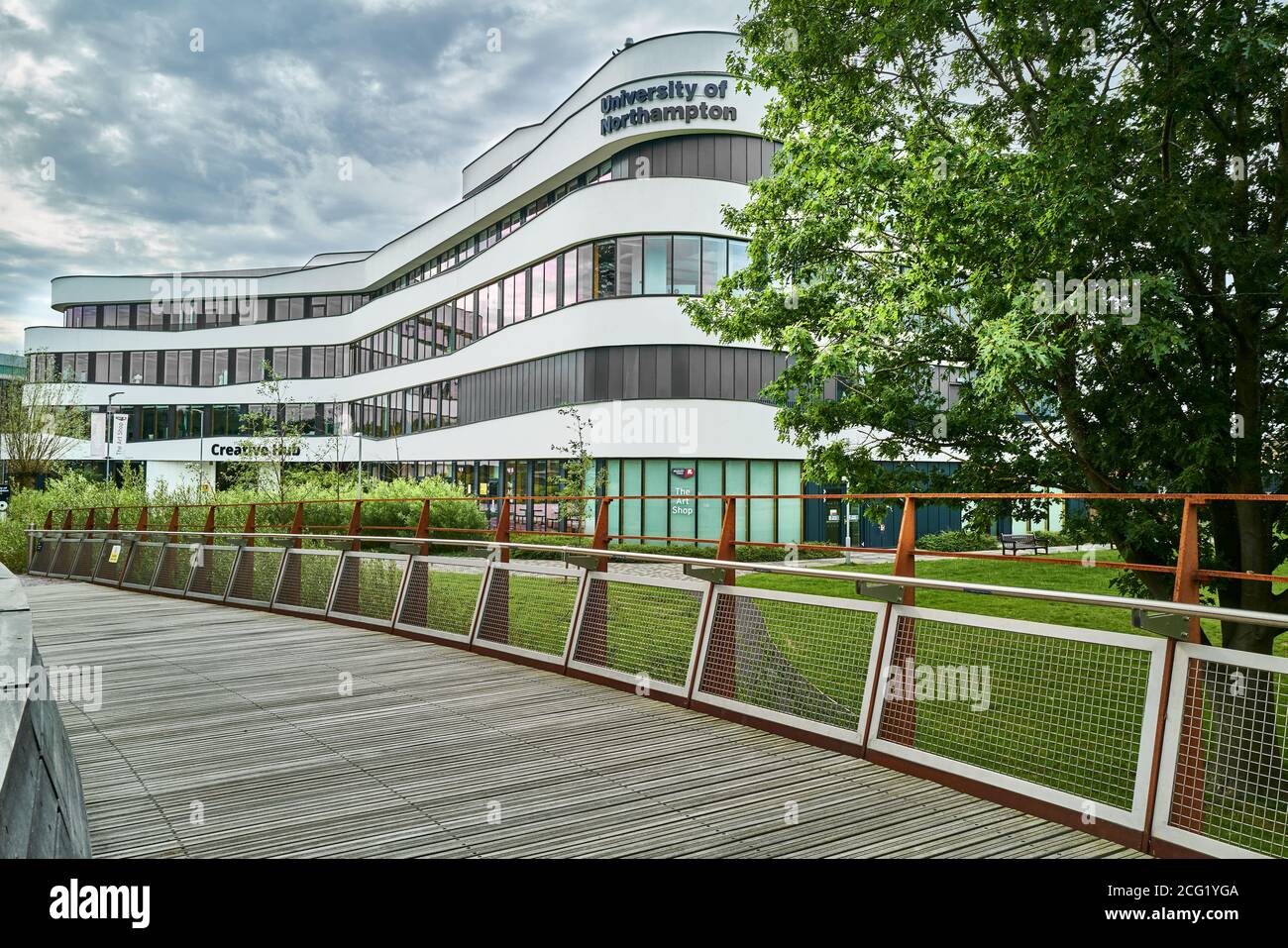 Pedestrian bridge over the river Nene to the Creative Hub building at ...