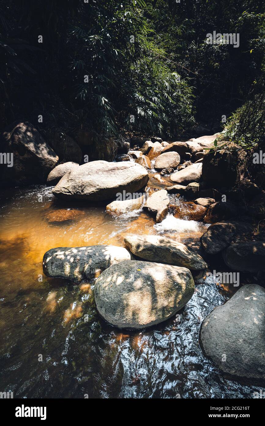 Clear streams and rocks during the day Stock Photo - Alamy