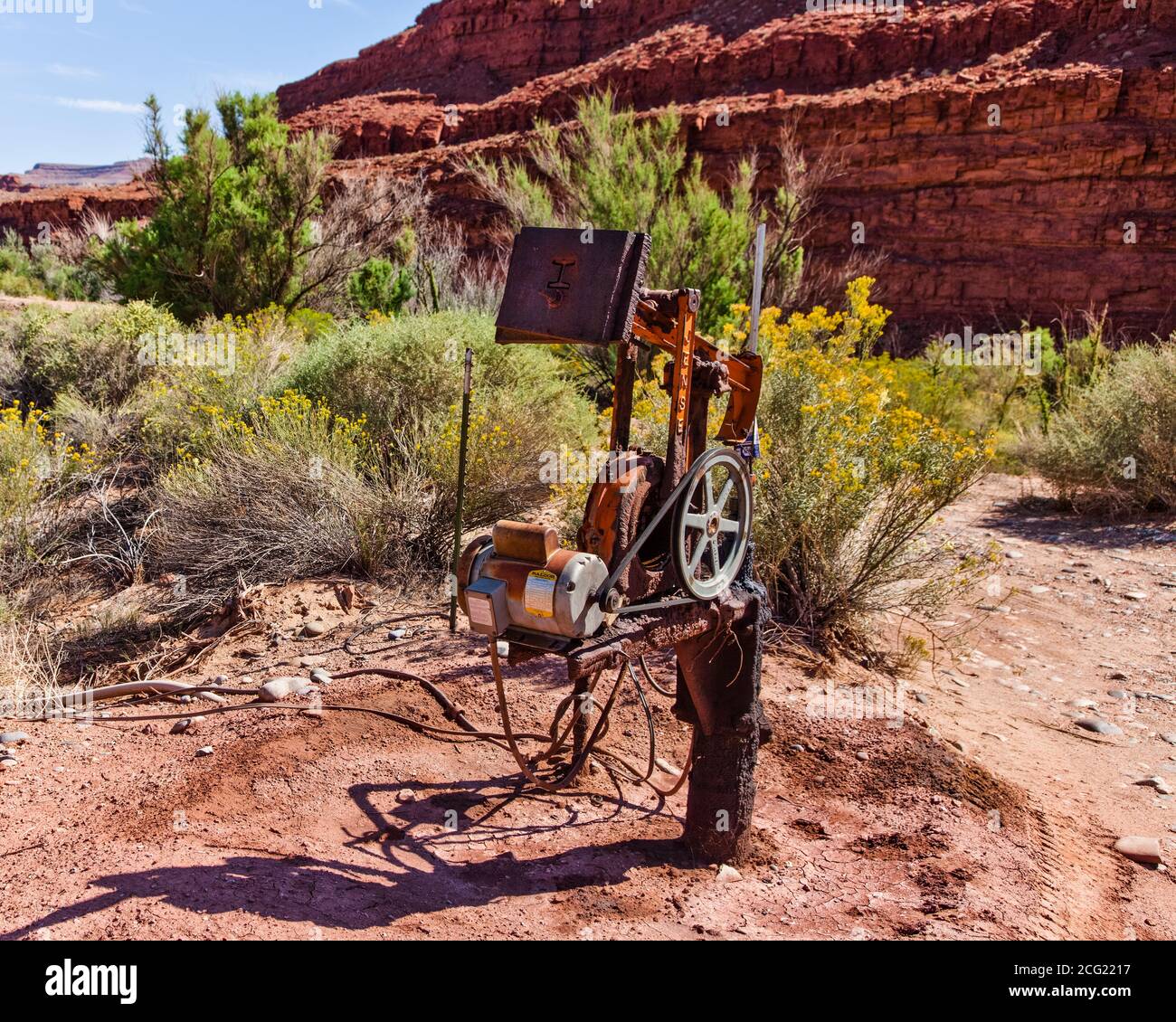 A shallow oil well with a very small pump jack in southeastern Utah ...