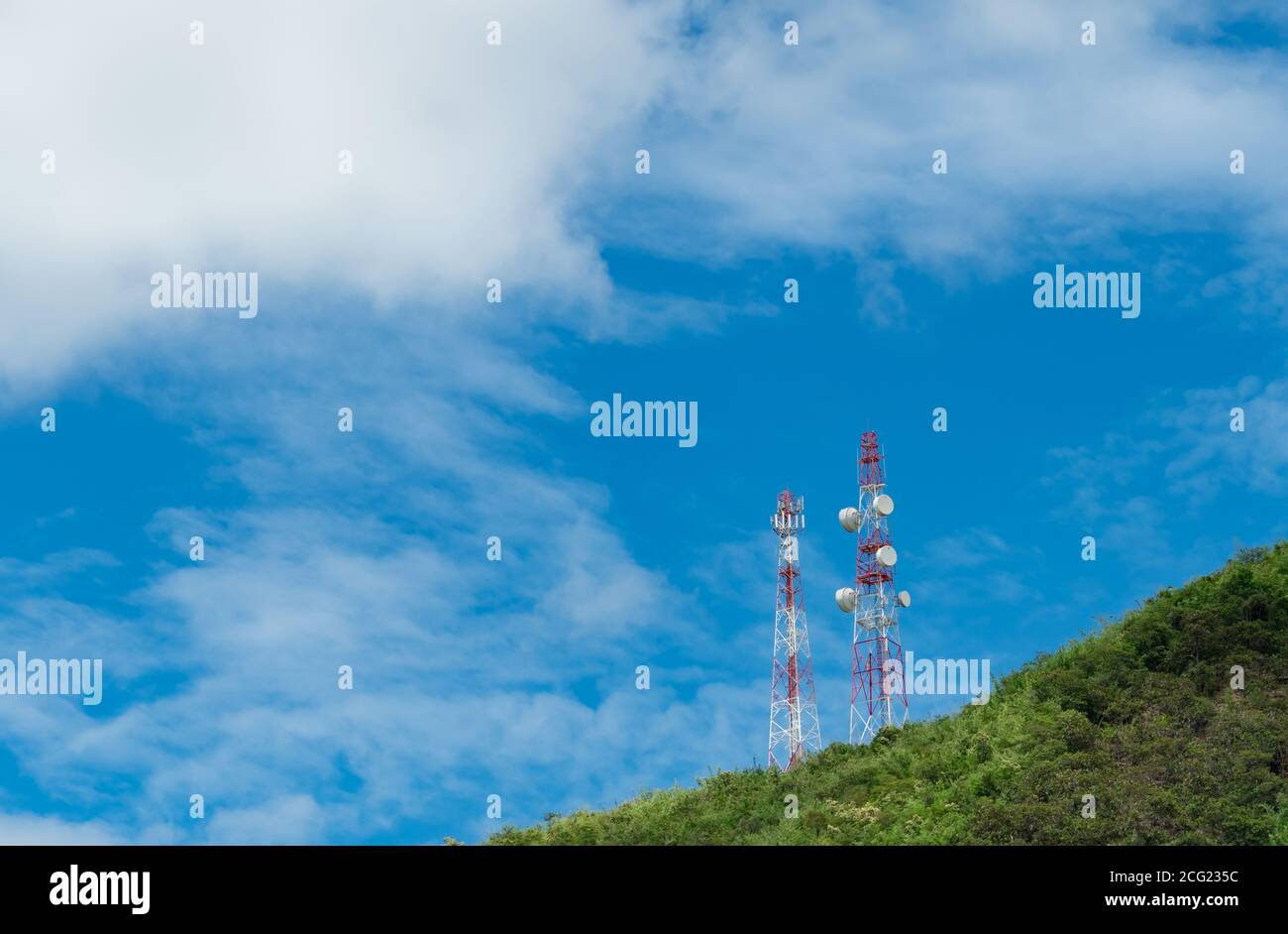 Telecommunication tower on mountain and green tree with blue sky ...